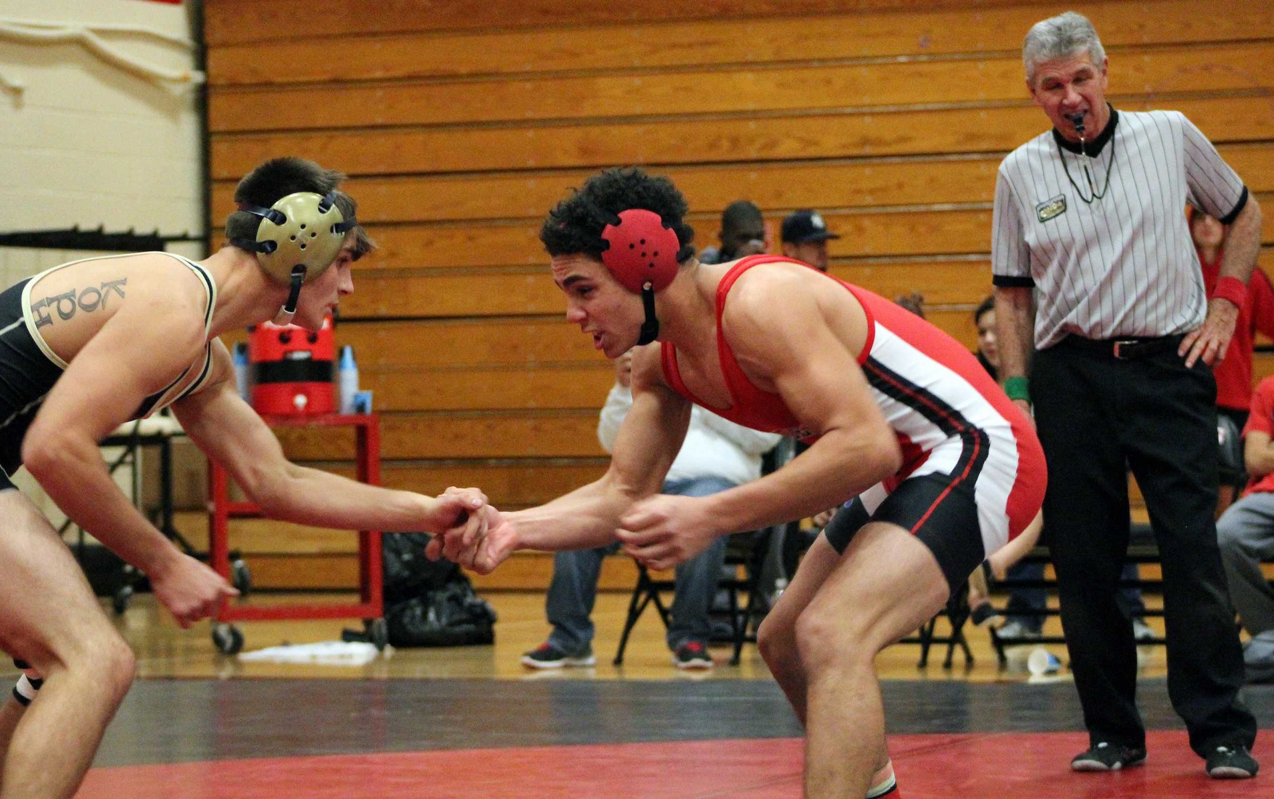 Photo of the day: Wrestlers try to pin Trojans for crown – The ...